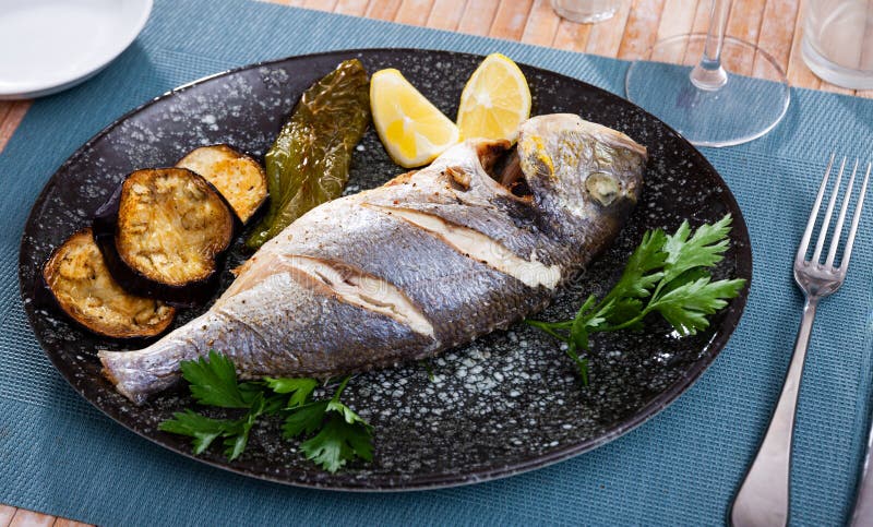 Dorada Fish Baked with Lemon Served with Vegetable Garnish Stock Image ...