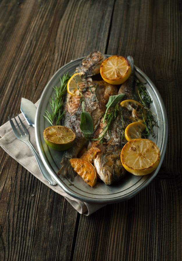 Dorada fish with lemon stock image. Image of food, gourmet - 60218185