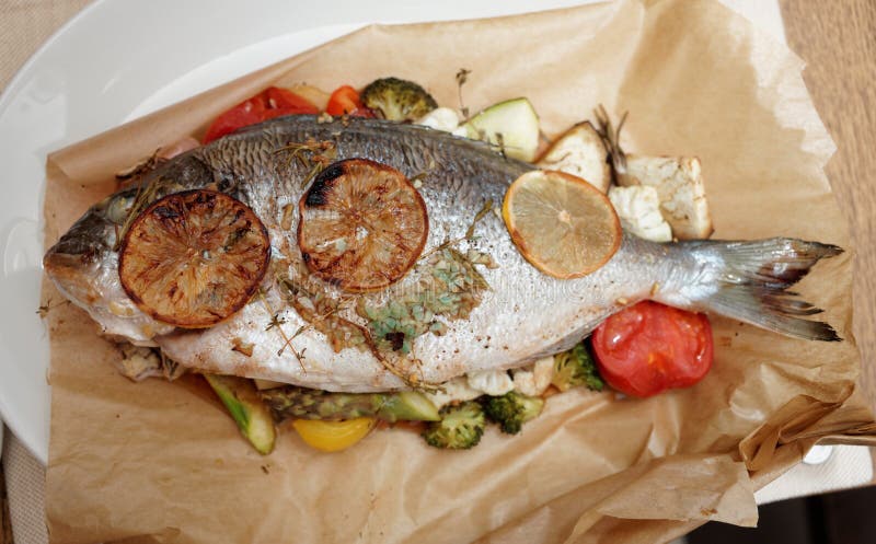 Dorade Roasted in Paper with Vegetables Stock Image - Image of aromatic ...