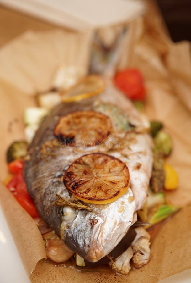 Dorade Roasted in Paper with Vegetables Stock Photo - Image of gilthead ...