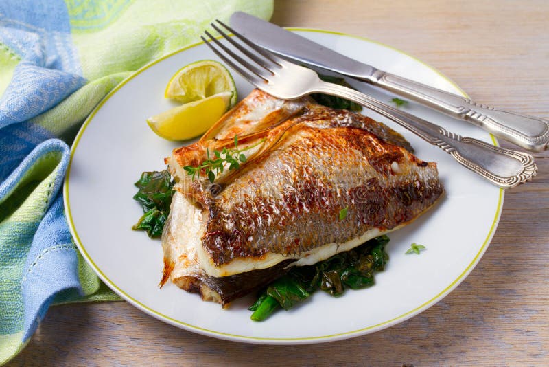 Dorado or Dorada Fish Fillet with Spinach, Thyme and Lime. Stock Photo ...