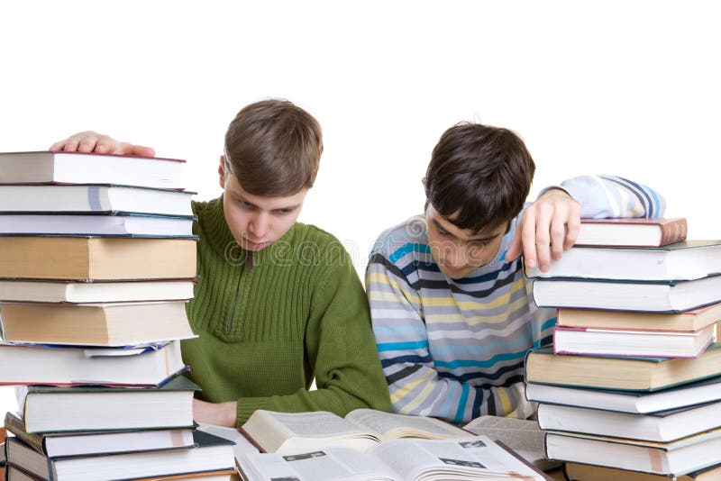 Dos Estudiantes Con Los Libros Aislados En Un Blanco Imagen. Imagen ...