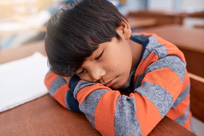 He Dosed Off Quickly. a Tired Elementary School Child Sleeping on His ...