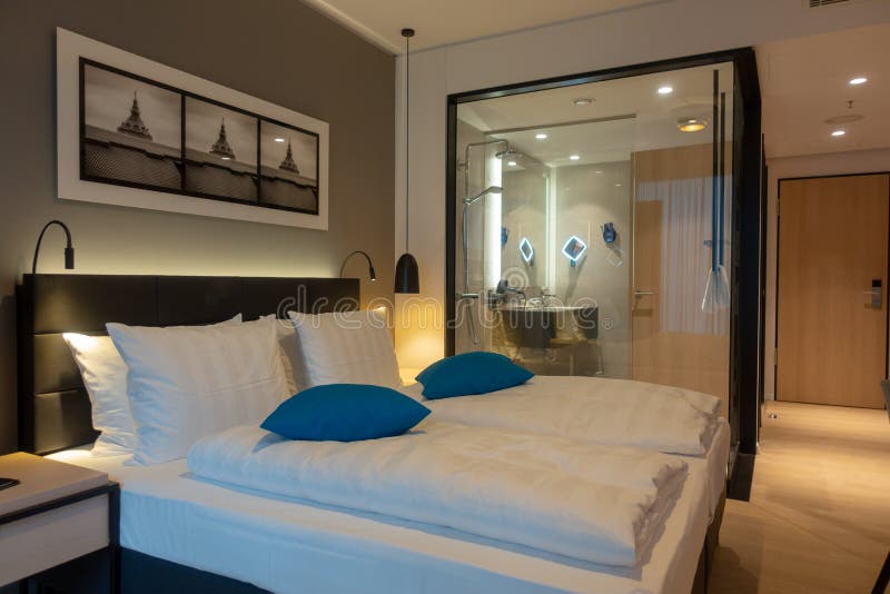 Double Bed in a Luxurious Hotel Room Stock Photo - Image of business ...