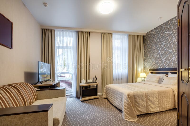 Double Bed with Pillows in Interior with Night Lamp in Hotel Room Stock ...