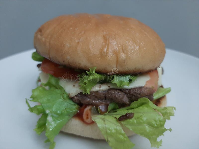 Double Beef Burger stock image. Image of burger, tomato - 261921809
