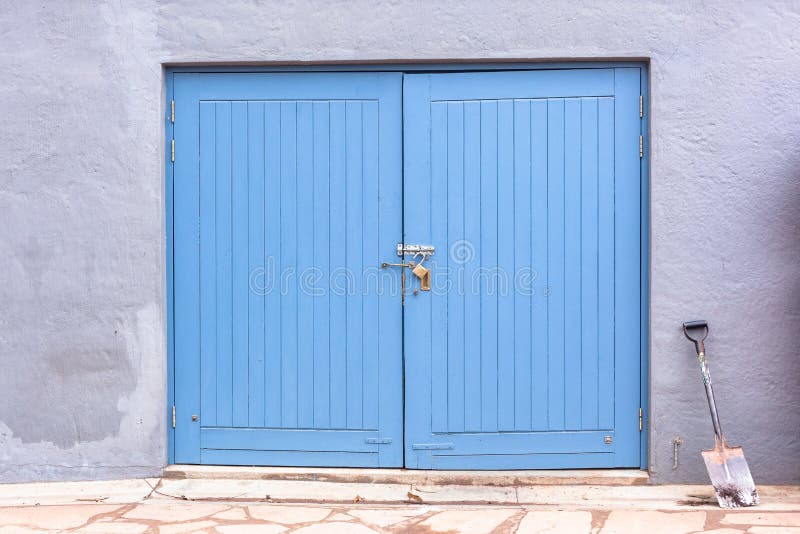 Double Blue Doors Workshop Spade Outdoors Stock Image - Image of paint, doubles: 260354341