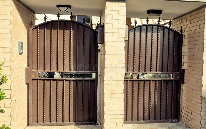 Double Brown Iron Gate in Fiumicino, Italy. Stock Photo - Image of ...