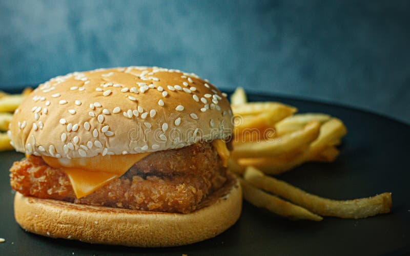 Double Burger Fish on Black Plate for Food Content Stock Photo - Image ...