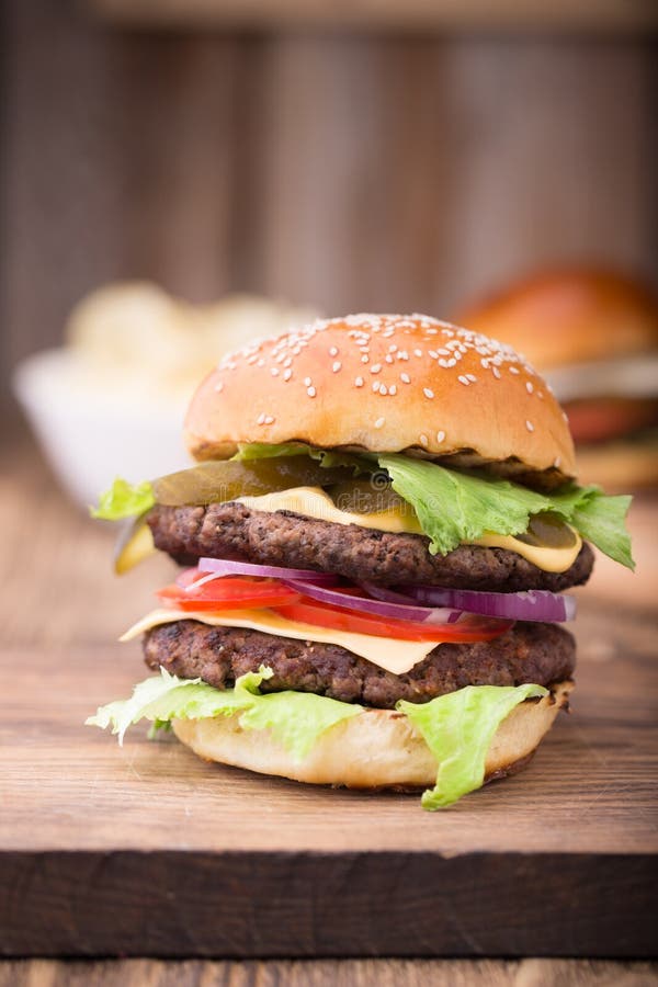 Double Burger on Wooden Board. Stock Photo - Image of chips, fast: 79601600