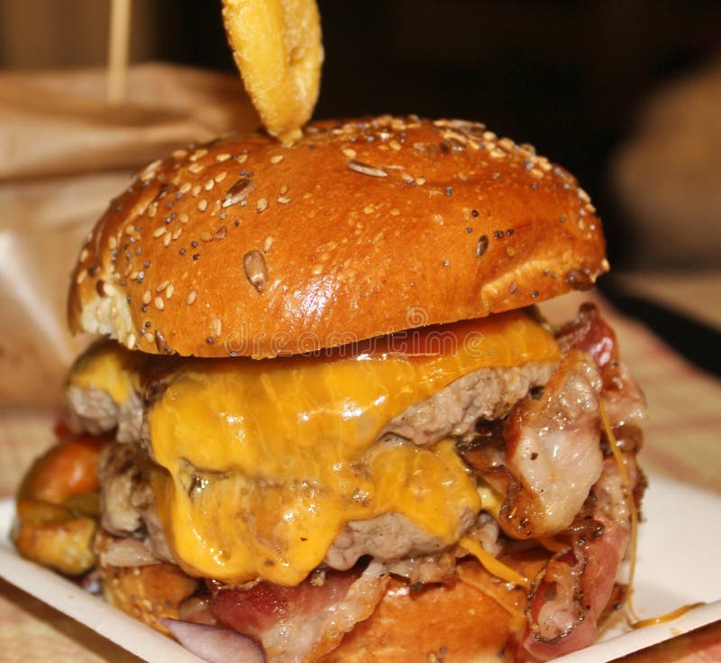 Double Cheeseburger and Smiley Chips Stock Photo - Image of food ...