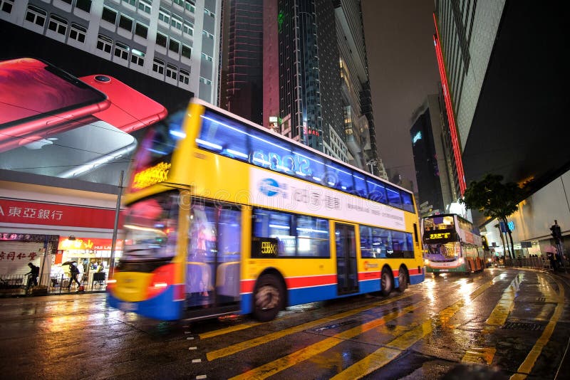 Double Decker Buses Drive on the Road of Causeway Bay on a Rainy ...