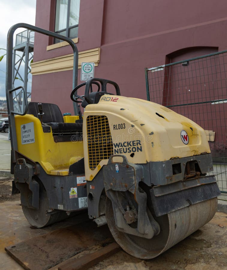 Patching the Road. Workers in Uniform Lay Asphalt from a Truck ...