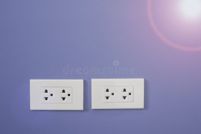 Double Electric Plug on the Dark Blue Wall Stock Image - Image of ...
