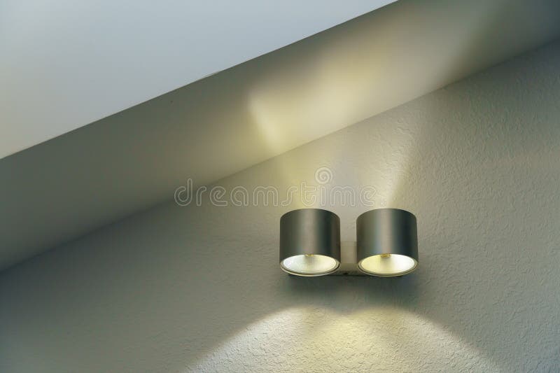 A Double Elegant Lamp on a White Wall. Designer LED Lamp on the Office ...