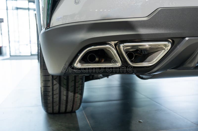 Double Exhaust Pipe in a New Car in a Car Showroom. Stock Photo - Image ...