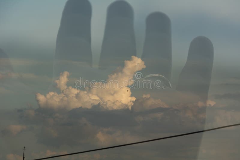 Double Exposure of Hand and Clouds. Double Exposure with a Digital ...