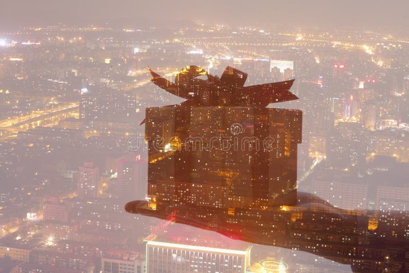 Double Exposure of Hand Holding Gift Over Night Cityscape Stock Photo ...