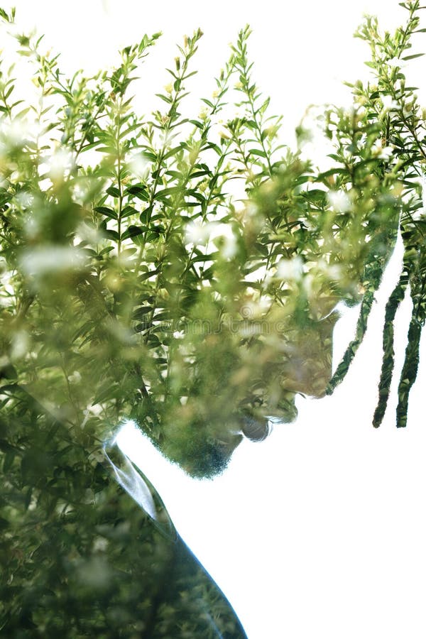 A Double Exposure Profile Portrait of a Man Combined with Foliage ...