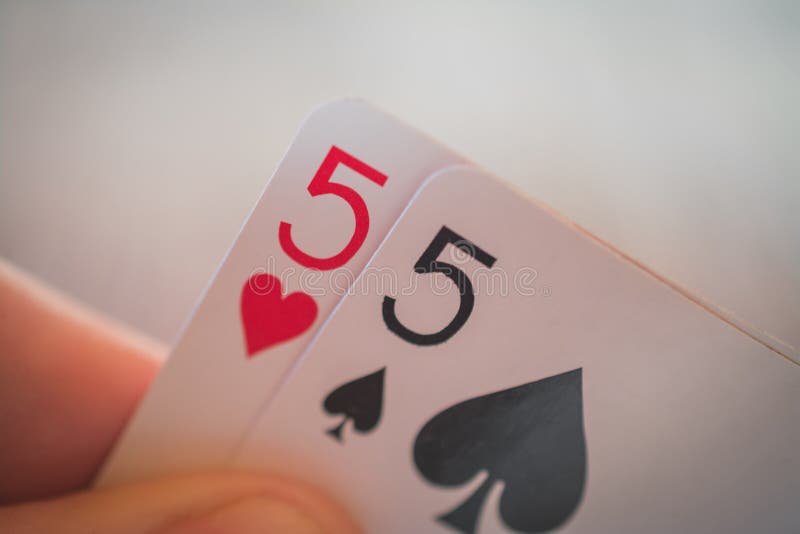 Double Five, Playing Cards in Hand on the Table, Poker Nands Stock ...