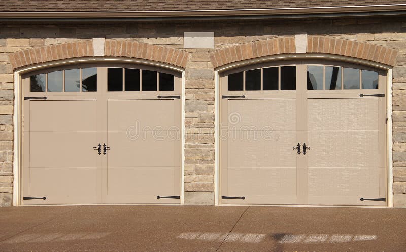 Double Garage Doors Driveway Stock Image - Image of windows, brick ...