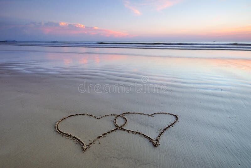 Double Heart Shape on the Beach Stock Photo - Image of heart, sandy ...