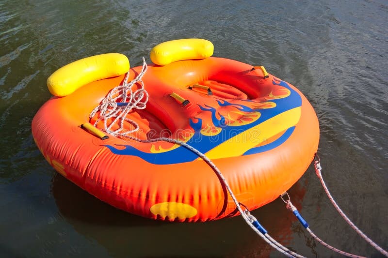 Double Inflatable Raft of Orange Color on the Water Surface. Stock ...