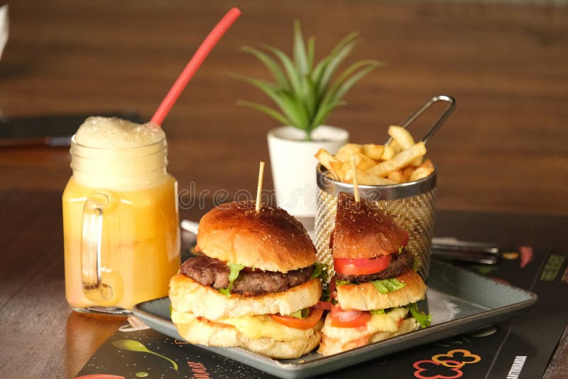 Double Meat Burger with Fried Onion Rings Stock Photo - Image of meat ...