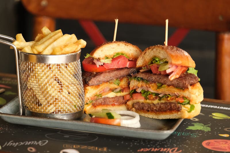 Double Meat Burger with Fried Onion Rings Stock Image - Image of ...