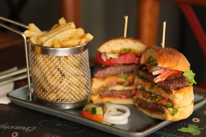 Double Meat Burger with Fried Onion Rings Stock Photo - Image of food ...