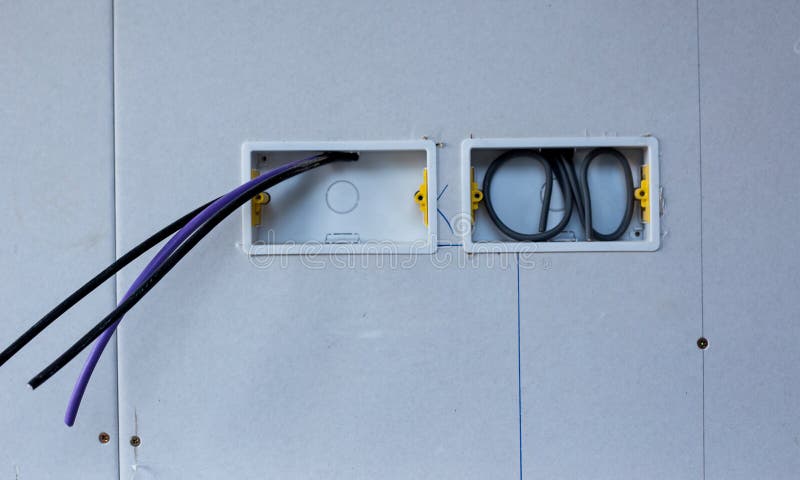 Double Plastic Socket Back Plates in a Plasterboard Wall. Stock Image ...