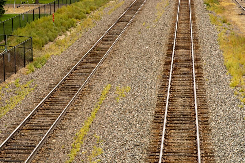 Double Railroad Train Tracks with Side Fence Stock Image - Image of ...