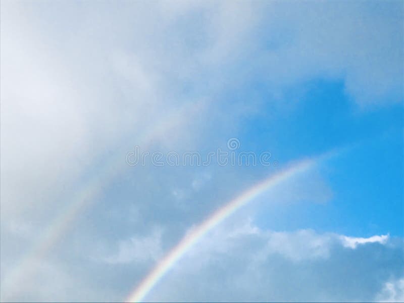 Rainbow in blue sky stock photo. Image of blue, sunny - 26865092