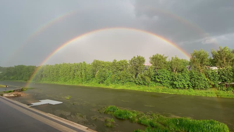 A Double Rainbow Can Be Seen from Both Ends Over the River in the City ...