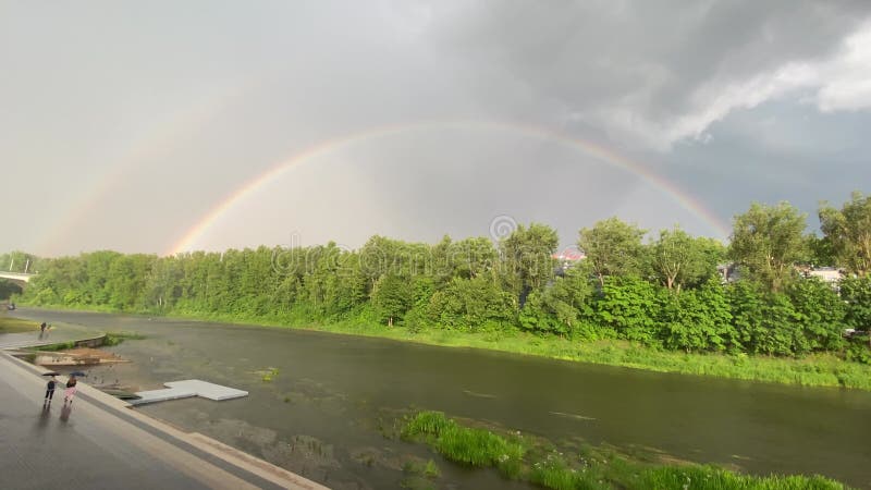 A Double Rainbow Can Be Seen from Both Ends Over the River in the City ...