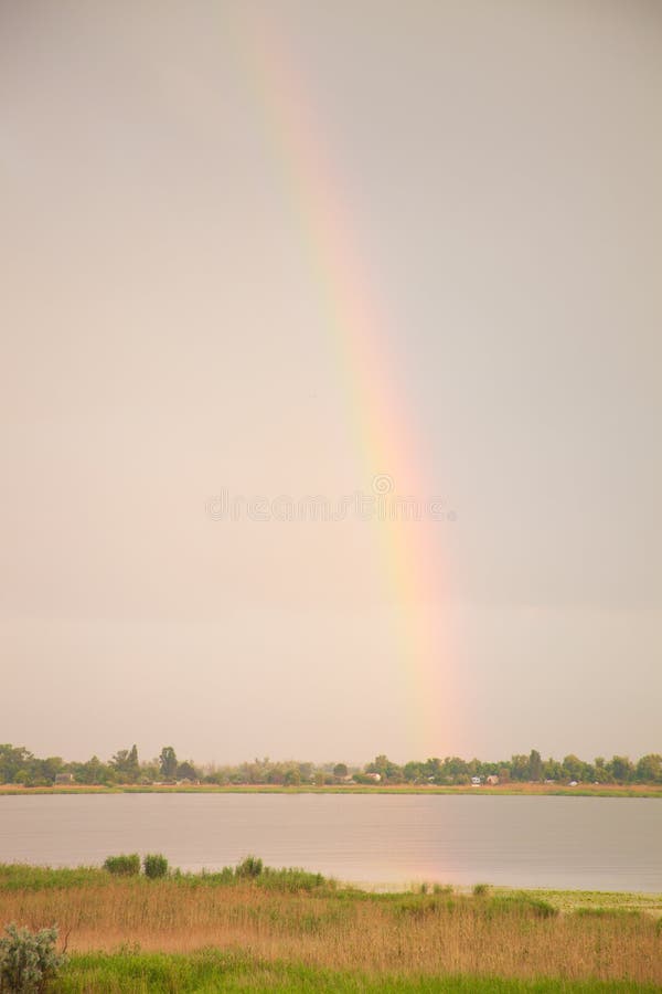 Double rainbow over a lake stock image. Image of rainbow - 80701737
