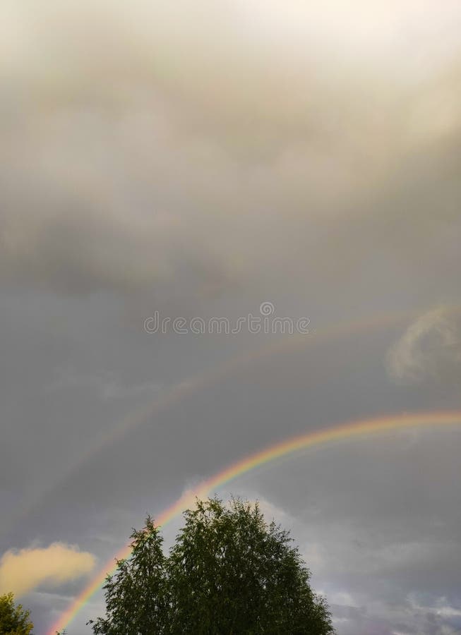 Double Rainbow in the Sky with Clouds Stock Photo - Image of clouds ... Double Rainbow in the Sky with Clouds Stock Photo - Image of clouds ...