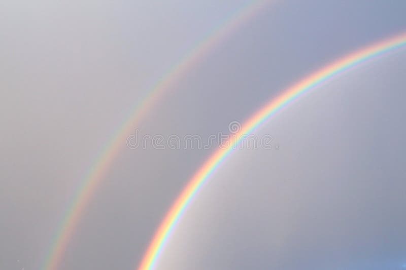Double rainbow in the sky stock photo. Image of gray - 221958132