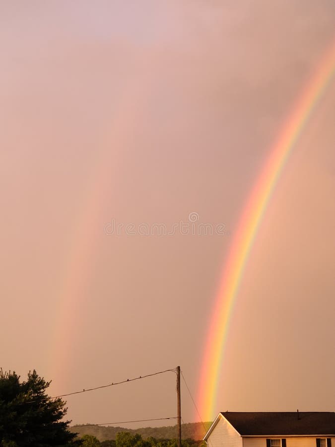 Double rainbow at sunset stock photo. Image of dusk - 258300276