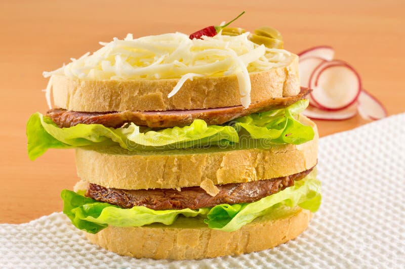 Double Sandwich With Ham, Cheese, Lettuce, Tomato And Green Olives ...