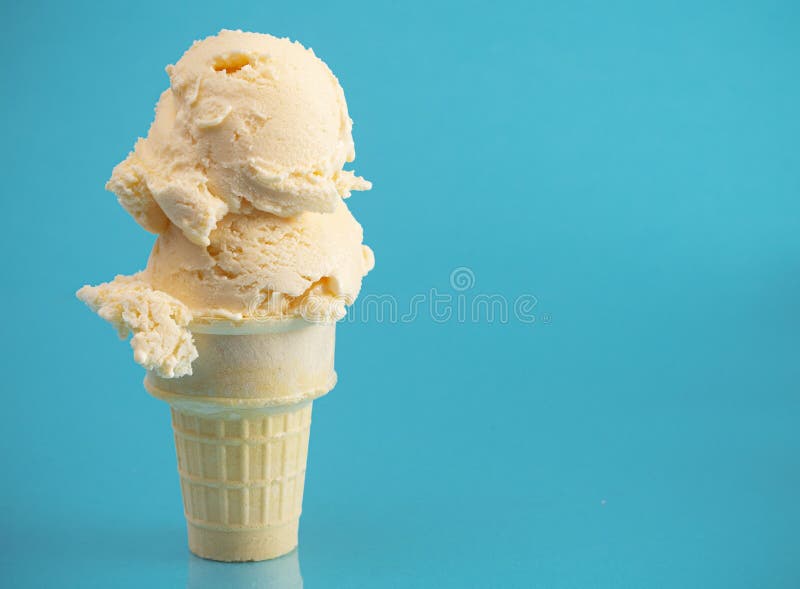 A Double Scoop Vanilla Ice Cream Cone on a Blue Background Stock Image ...