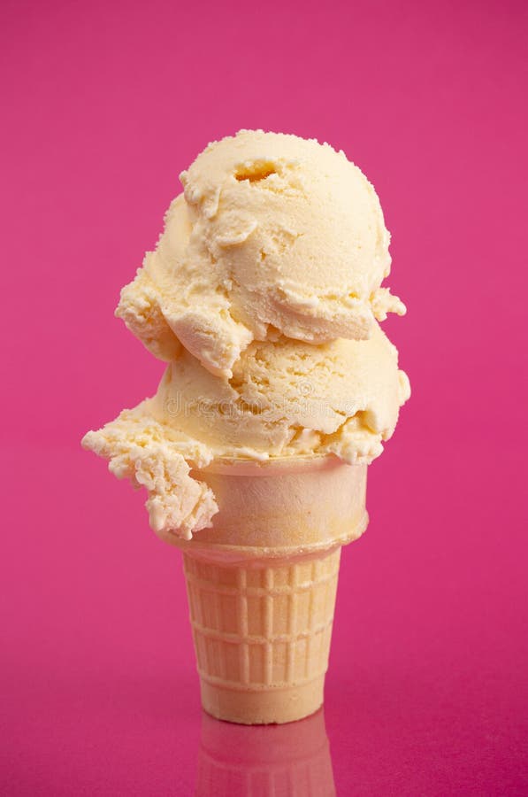A Double Scoop Vanilla Ice Cream Cone on a Purple Background Stock ... A Double Scoop Vanilla Ice Cream Cone on a Purple Background Stock ...
