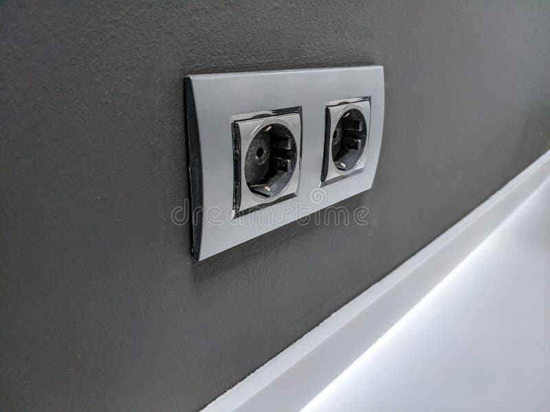 Double Socket with Light Grey Frame on Dark Grey Wall Stock Image ...