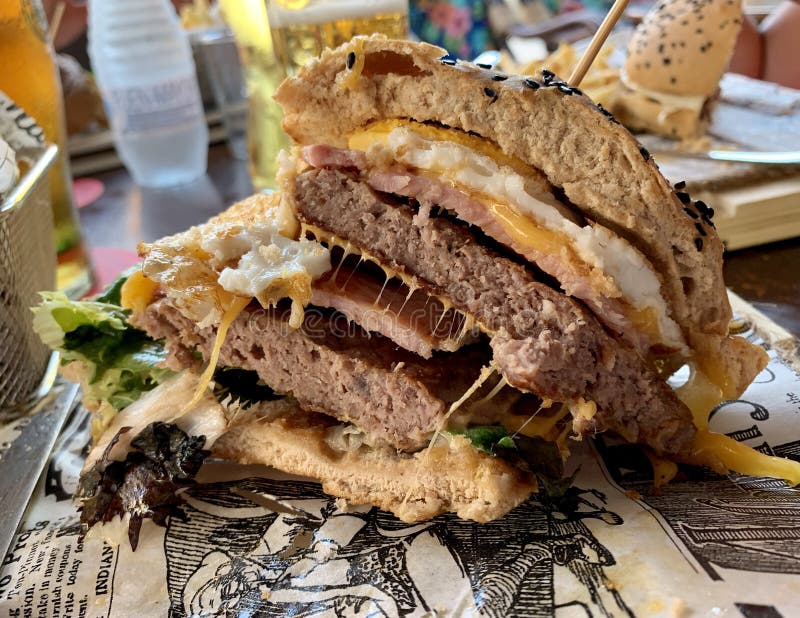 A Double Stacked Cheese and Bacon Burger Stock Image - Image of runny ...