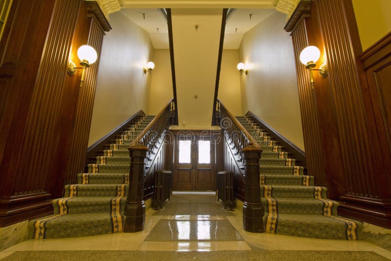 Double Staircase in Foyer stock image. Image of foyer - 14076829