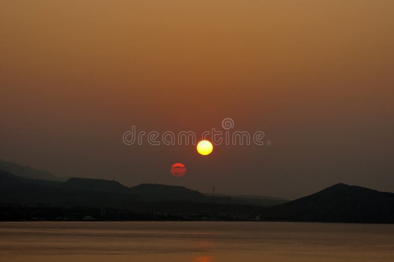 Double sunrise at seaside stock image. Image of seaside - 34297303