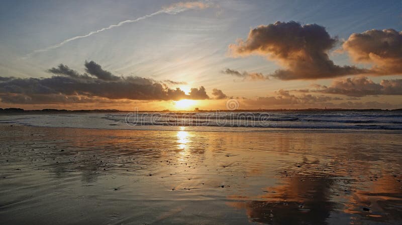 Double Sunset or the Charm of Reflections on the Beach Stock Photo ...