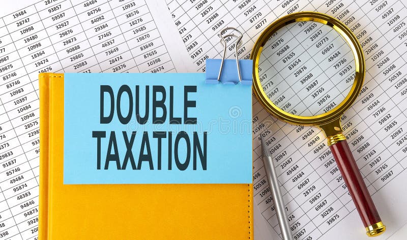 DOUBLE TAXATION Text on Sticker on Notebook with Magnifier and Chart ...