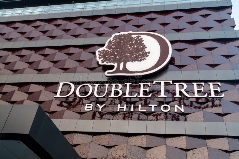 Double Tree Hilton Hotel. Logo on the Facade of the Hotel Building ...