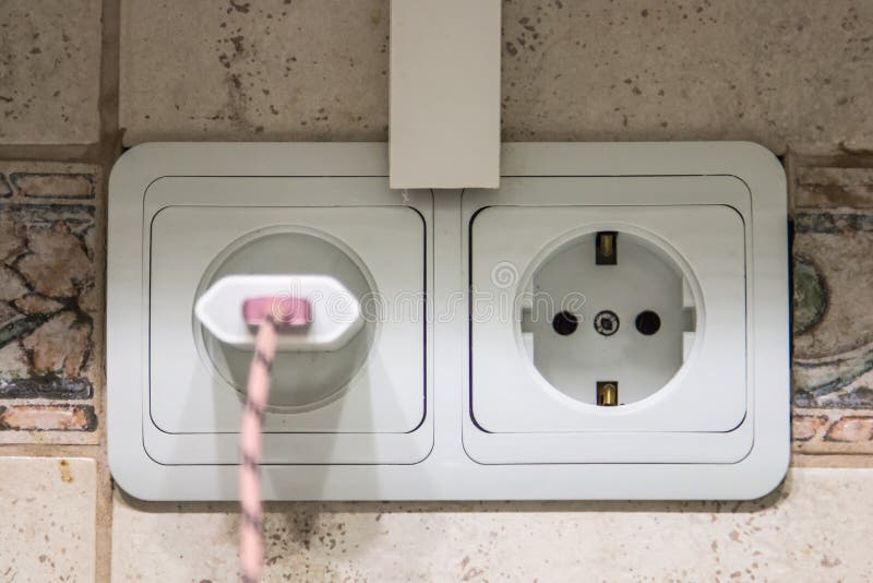Double White Outlet on the Tile Kitchen with a Charge from the Mobile ...